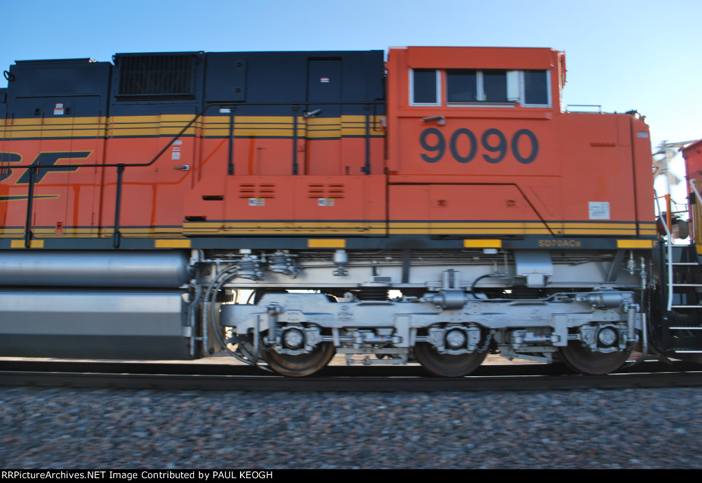 Side View of the Right Side of BNSF 9090 as she rolls through the crossing and passes me by at ...